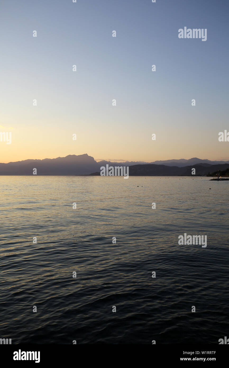 Beautiful sunset at Garda lake in Italy Stock Photo - Alamy