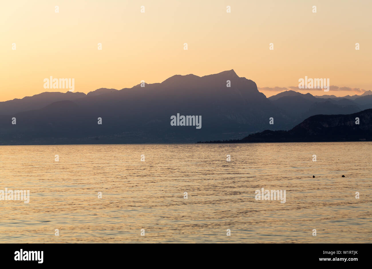 Beautiful sunset at Garda lake in Italy Stock Photo - Alamy