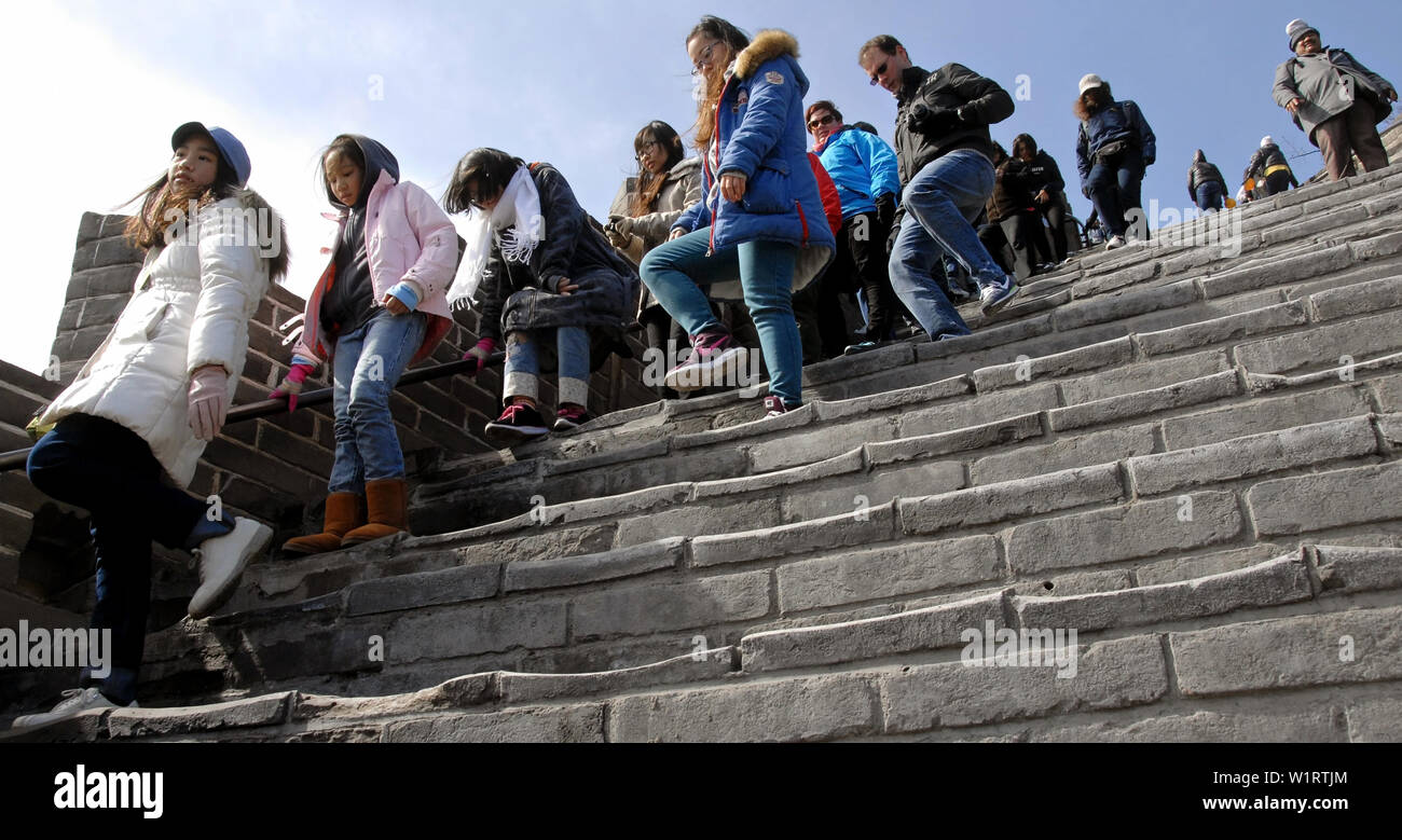 Great Wall of China at Juyongguan Beijing. Visitors walk on a steep ...