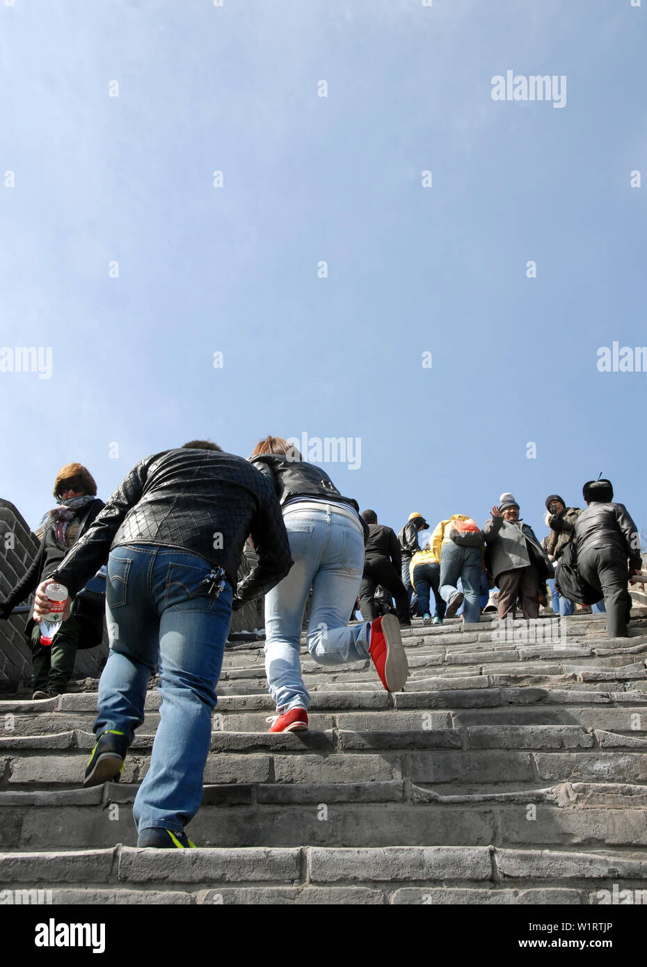 Great Wall of China at Juyongguan Beijing. Visitors walk on a steep ...