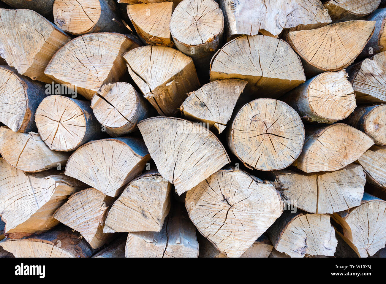 Wall of stacked wood logs as background - high resolution image Stock ...
