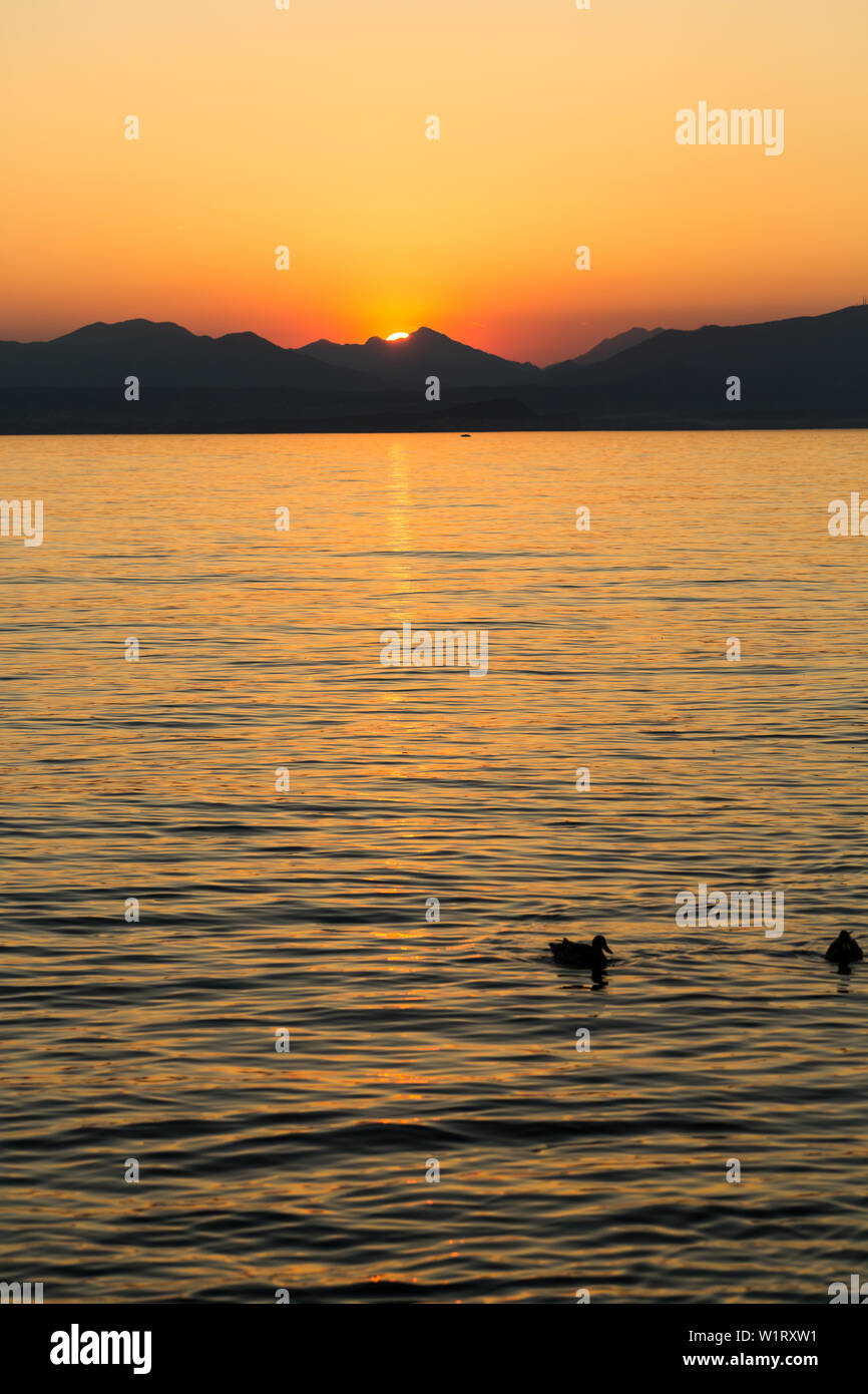 Beautiful sunset at Garda lake in Italy Stock Photo - Alamy