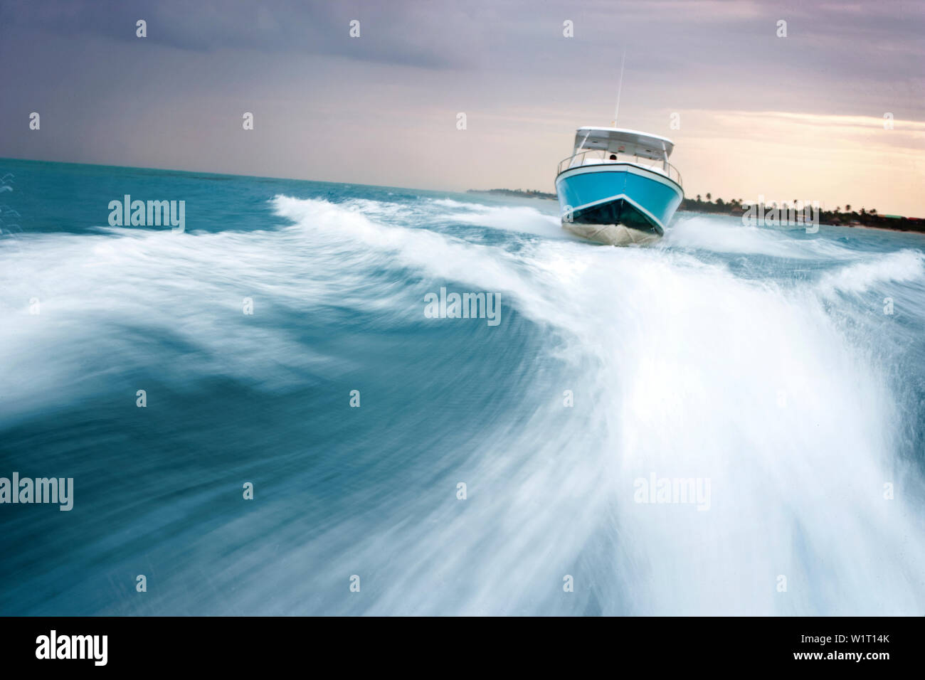 Speeding jet boat traveling over waves Stock Photo - Alamy