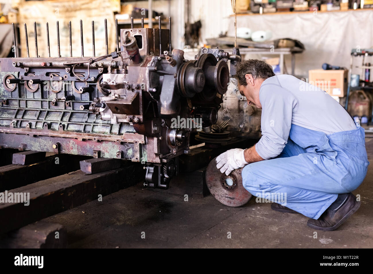 Mechanic opened the locking valve mechanism. Disassemble engine block ...