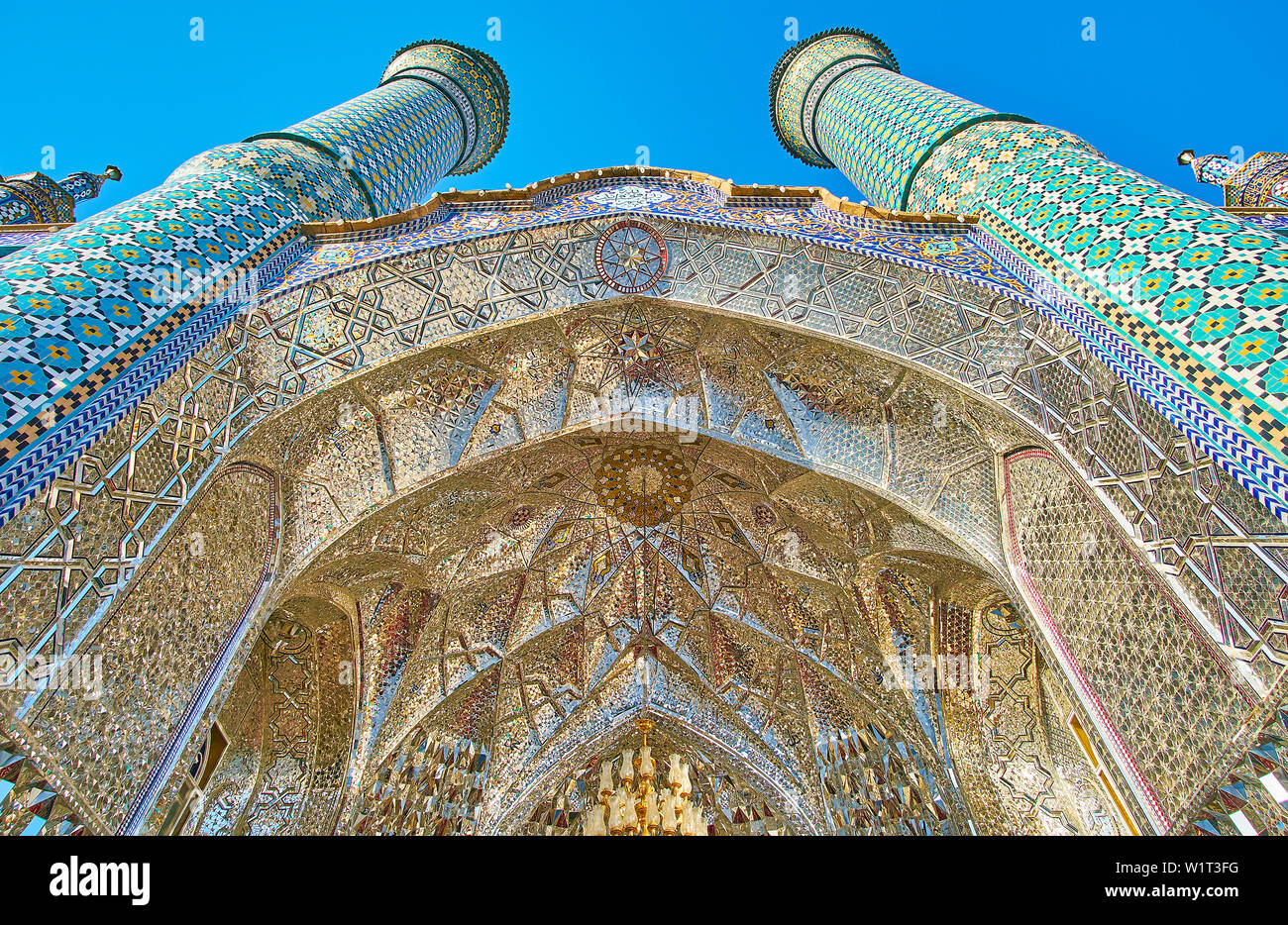 The ornate decoration of the iwan (portal) of Imamzadeh Helal Ali Holy ...