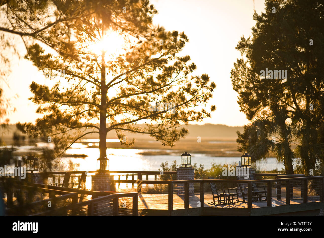 Lakeside deck at sunset Stock Photo - Alamy