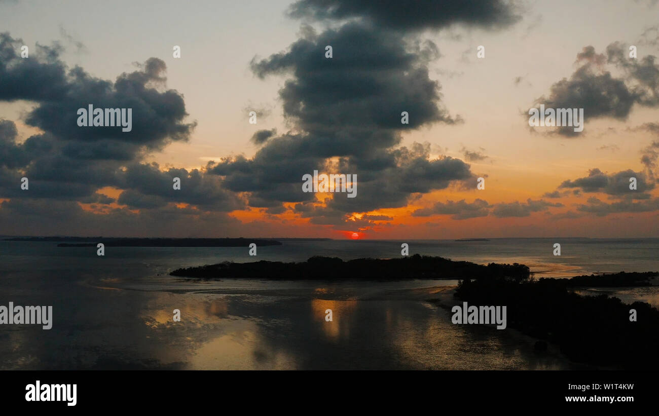 Colorful sunset over tropical islands, aerial view. Sunset over ocean ...