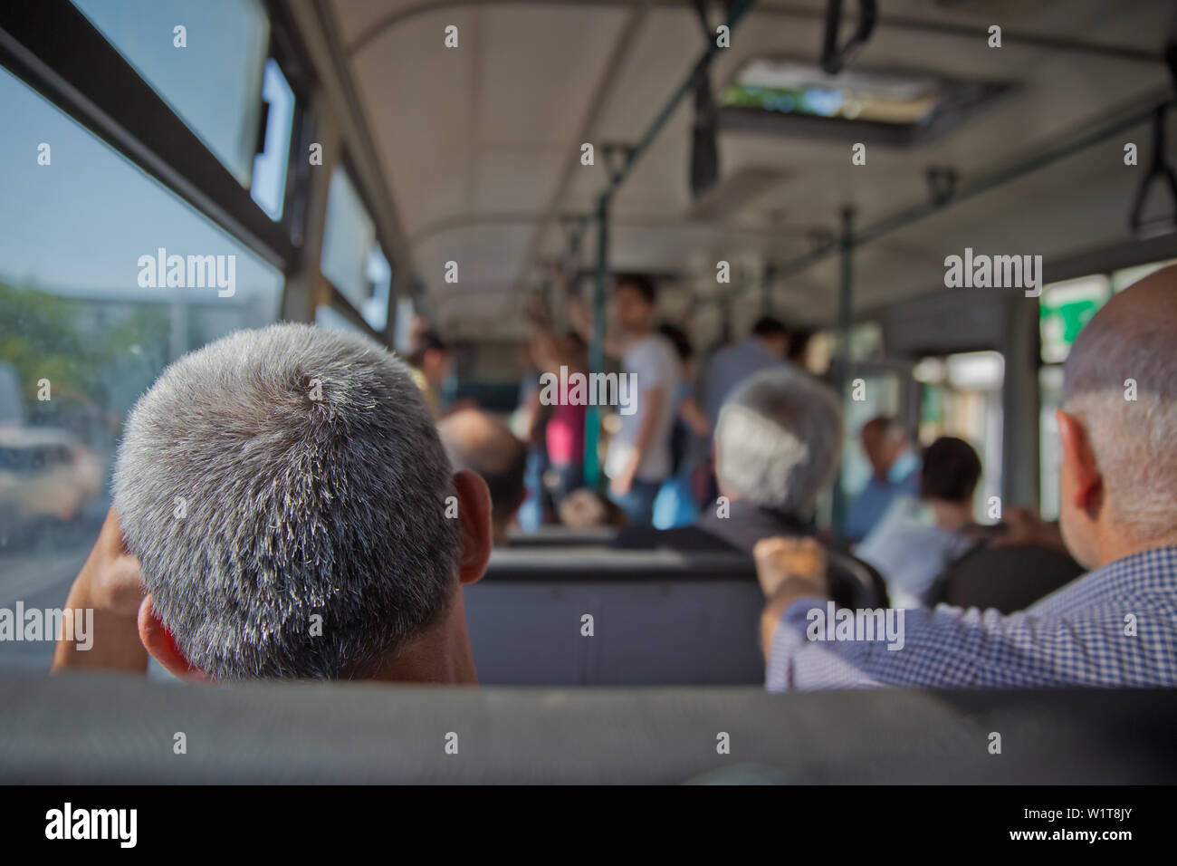 People sitting on a comfortable bus in Selective focus and blurred ...