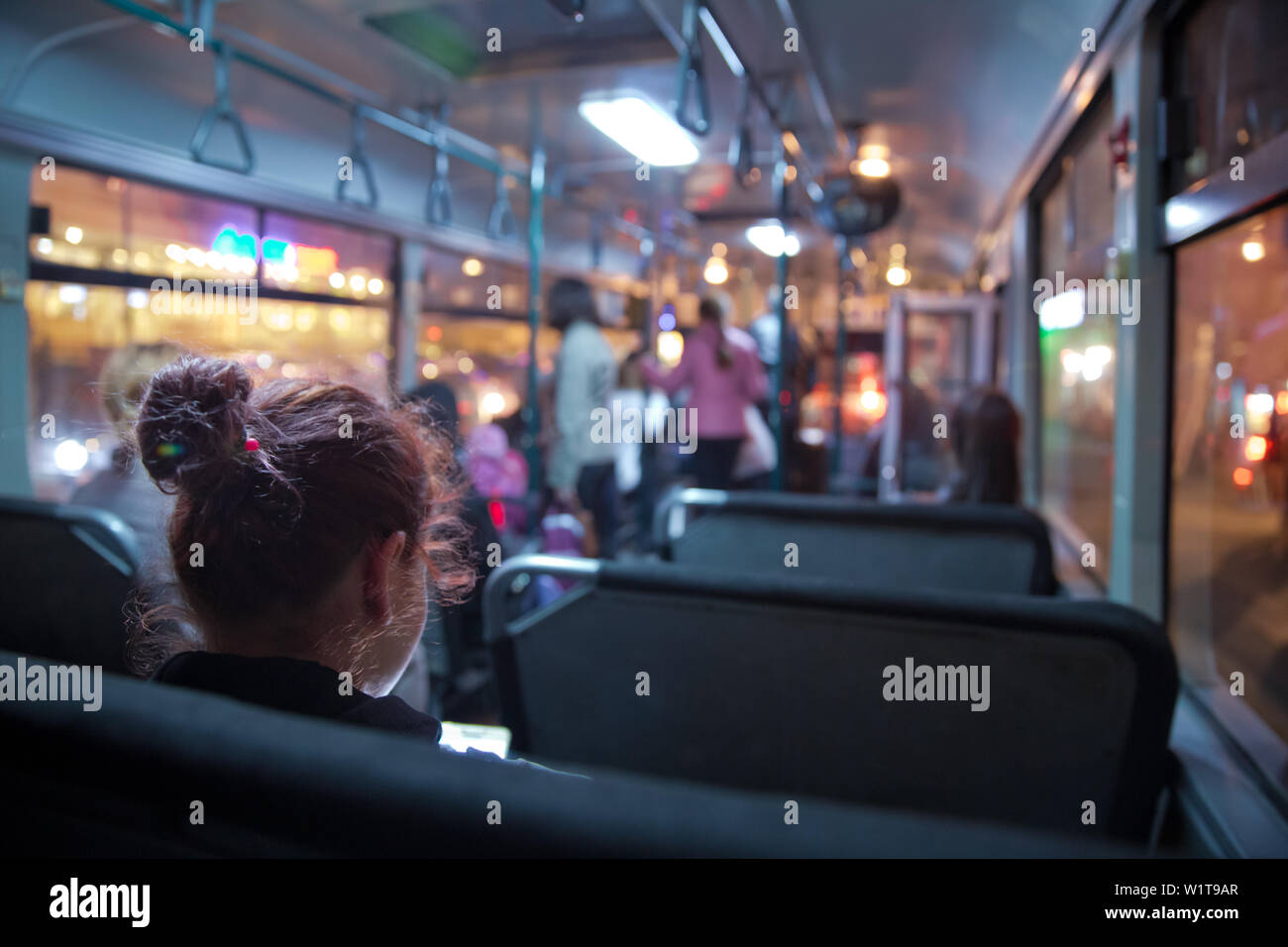 People sitting on a comfortable bus in Selective focus and blurred ...
