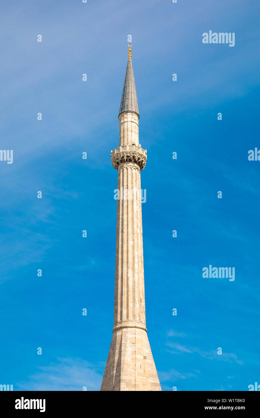 Turkish mosque minaret under the blue sky in Istanbul city of Turkey ...