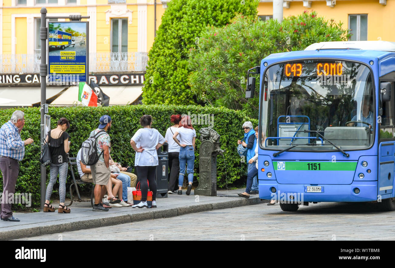 COMO, ITALY - JUNE 2019: Bus arriving at a bus stop in Como on Lake ...