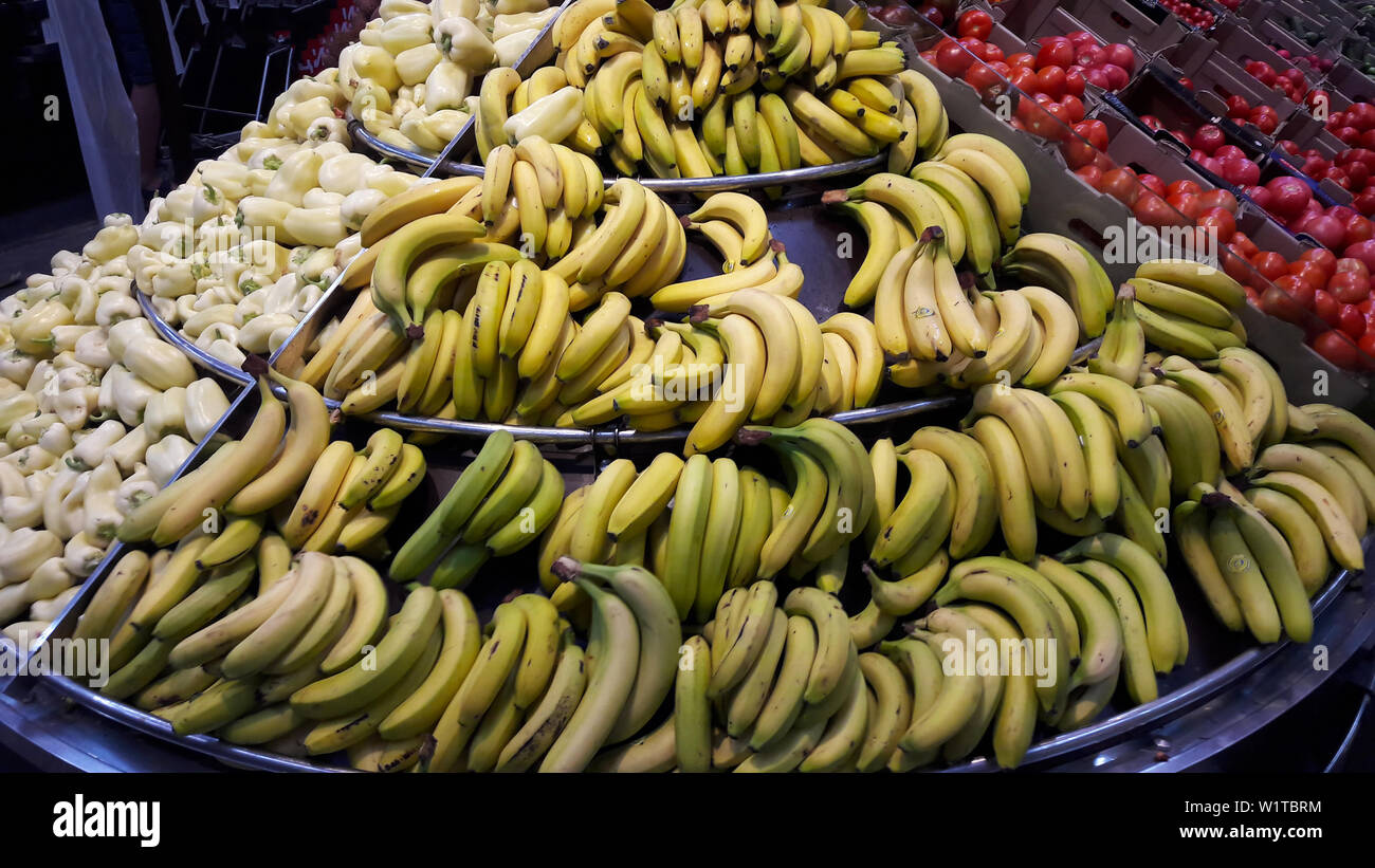 Bananas on the shelf in the store. A bunch of bananas. Yellow bananas ...