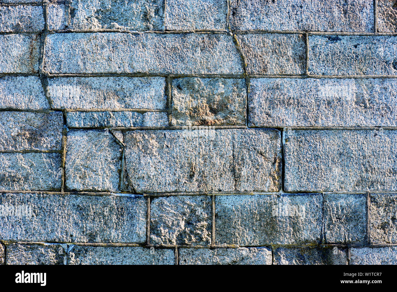Solid square stone wall background Stock Photo - Alamy