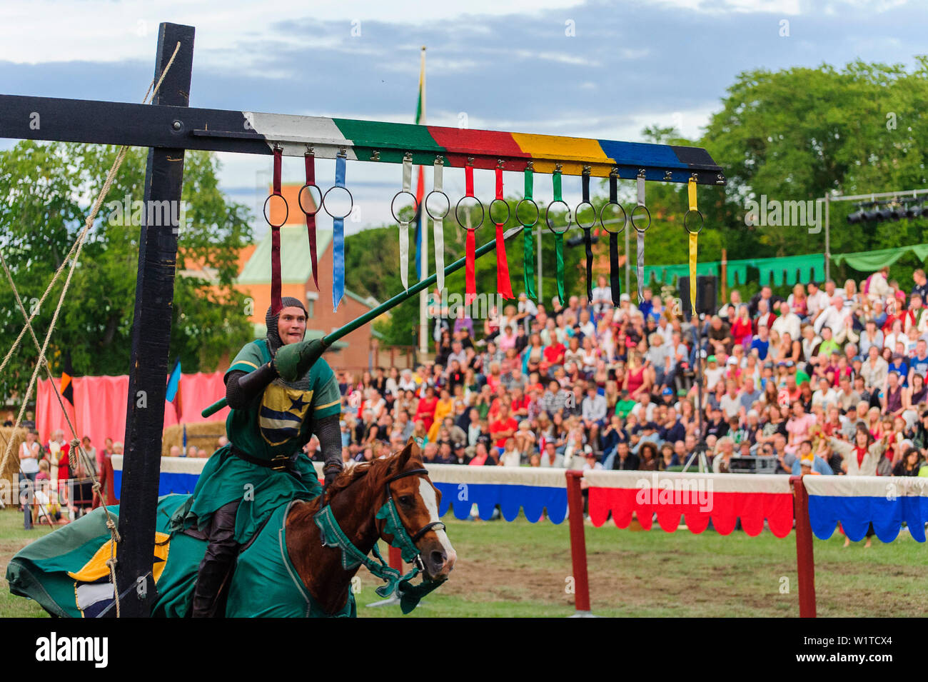 Medieval festival Knights games, riders with lance at the jousting ...