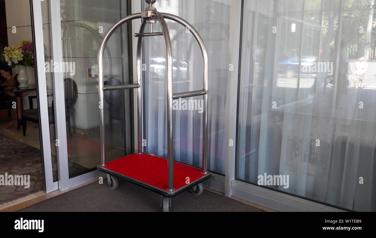 Trolley at the hotel. Luggage trolley for a hotel, trolley in the lobby ...