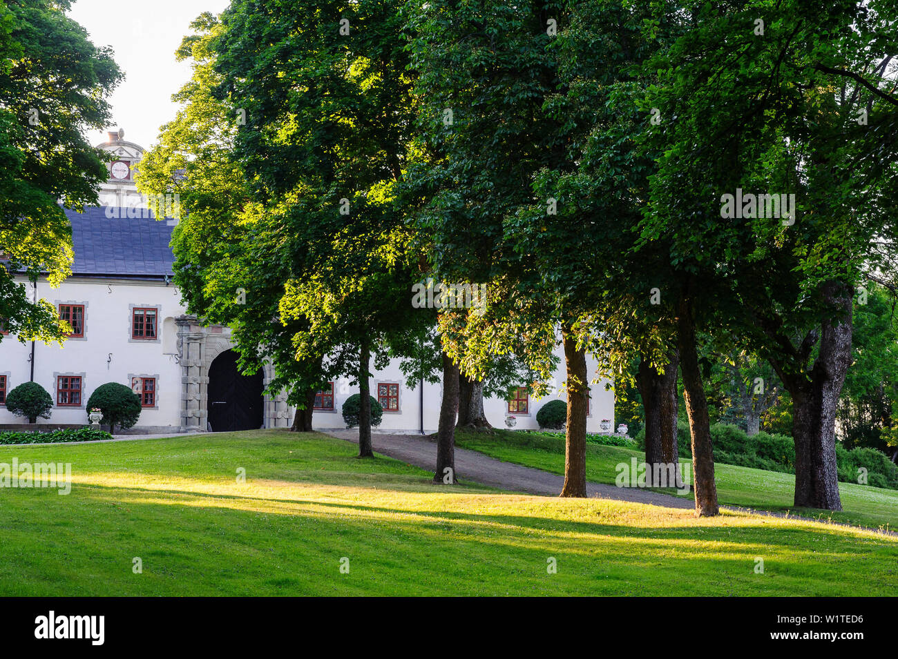 Castle driveway with tree alley from Tidoe Castle, Sweden Stock Photo ...
