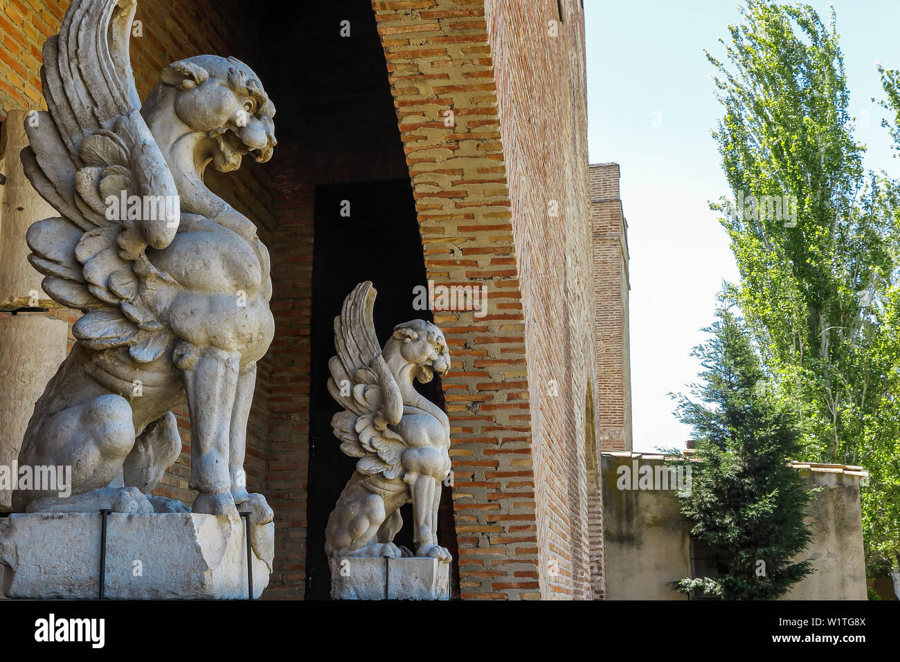 horizontal side view of two gargoyles carved in stone Stock Photo - Alamy