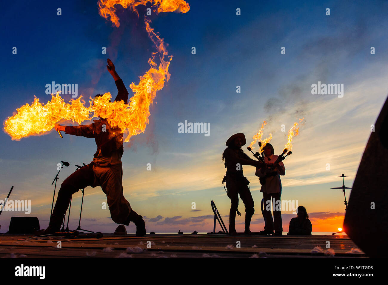 People in costumes make fire show, medieval festival, opening ceremony ...
