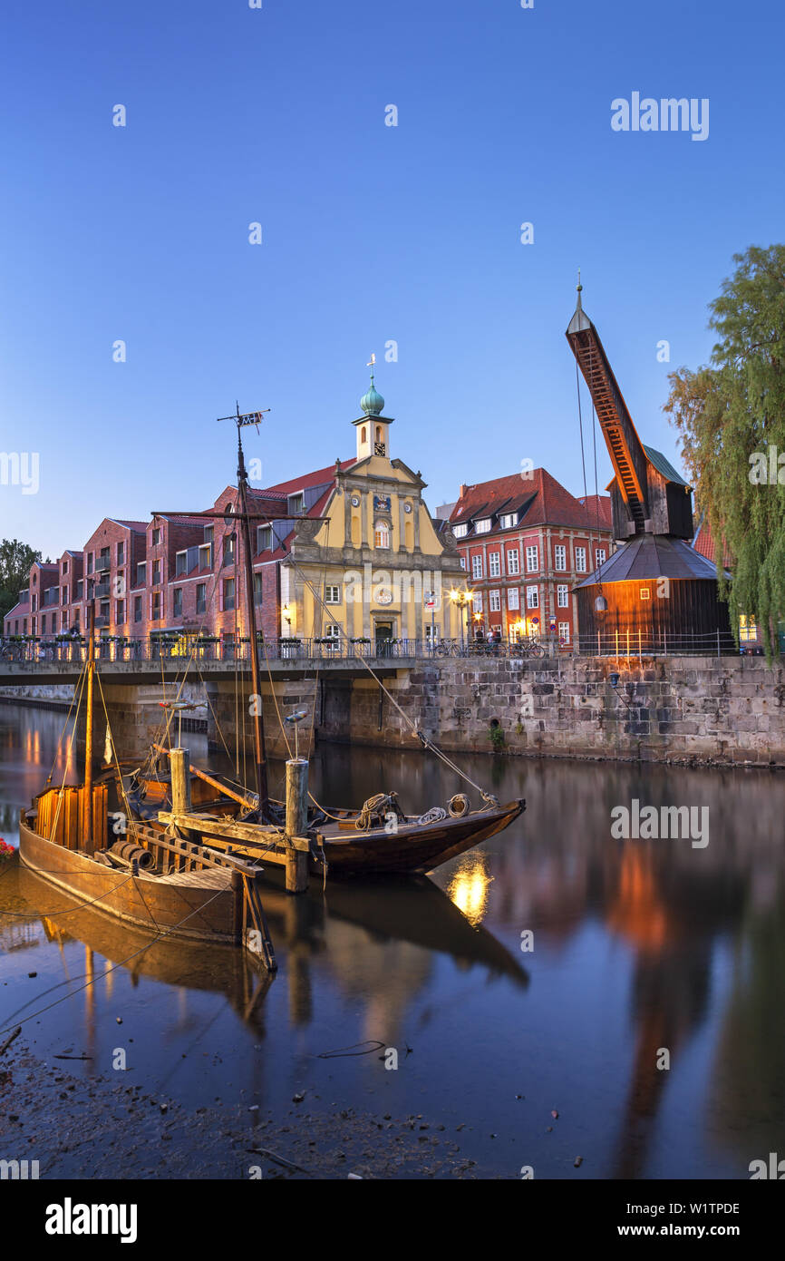 Sailing ships, crane and houses by the old harbour in the Hanseatic ...