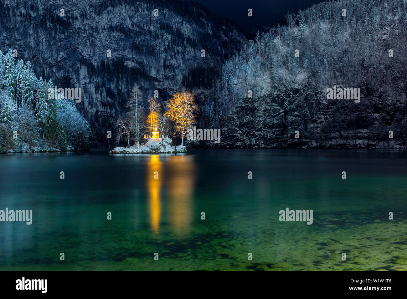 The small island in the Lake Königssee with illuminated John Christian ...