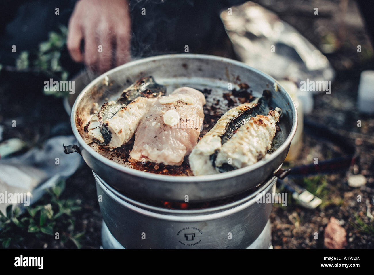 man preparing a fish, greenland, arctic Stock Photo - Alamy