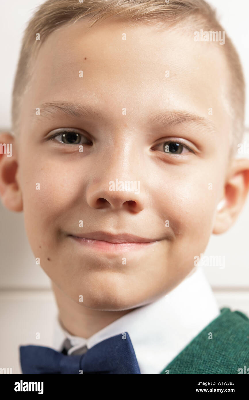 A 10-year-old boy prepares for school after a long summer break. Back ...