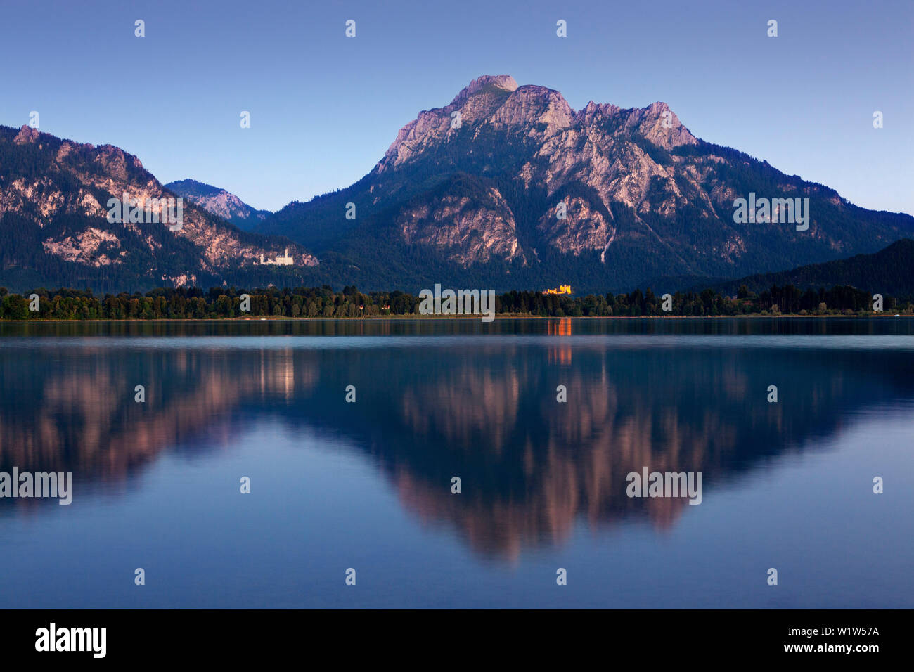 View over lake Forggensee to Neuschwanstein castle, Hohenschwangau ...