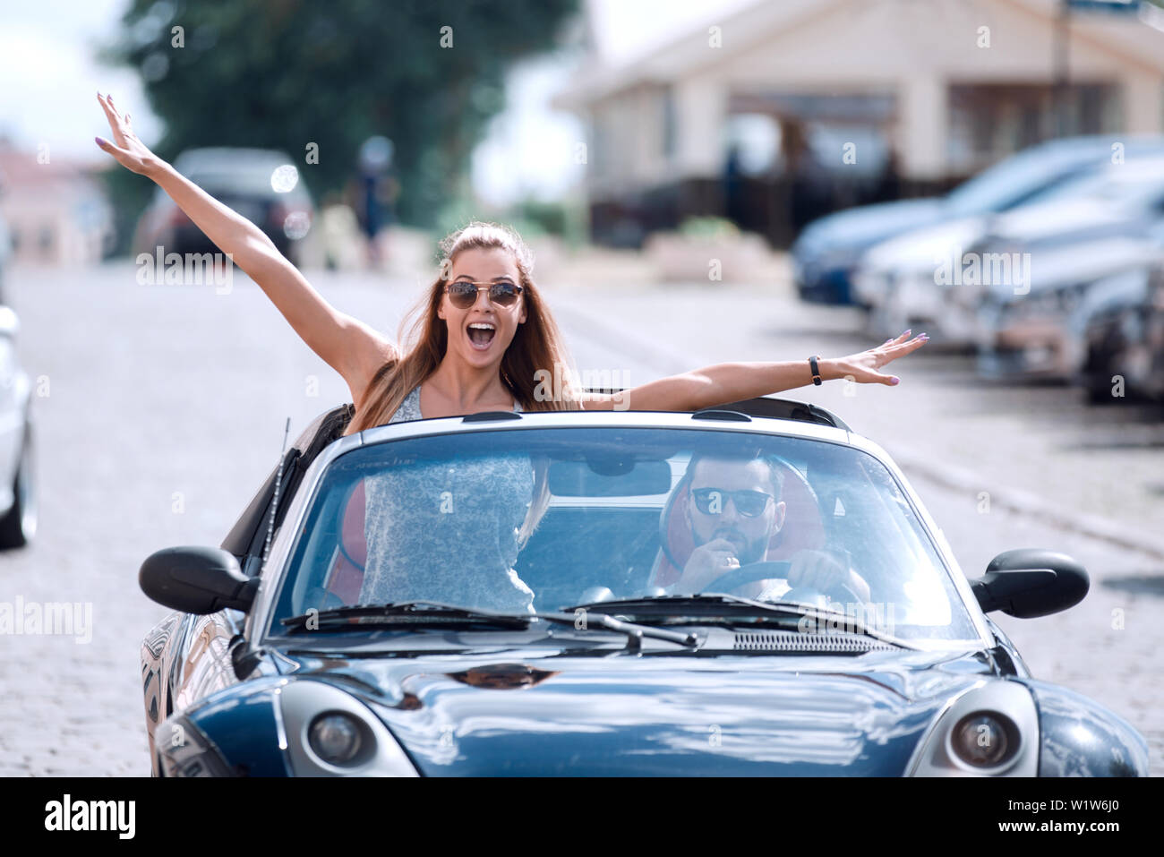 happy woman in a convertible car Stock Photo - Alamy