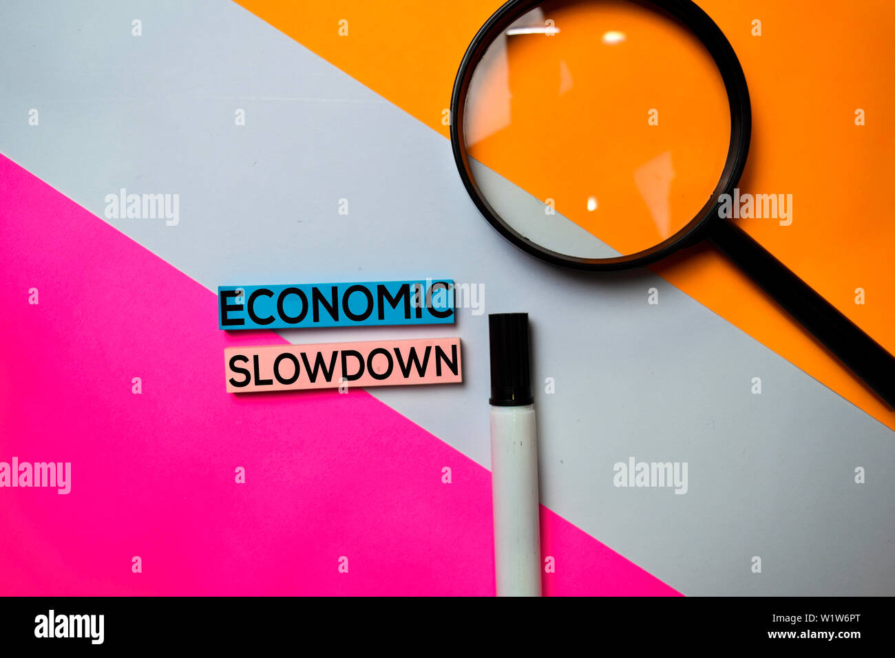 Economic Slowdown text on sticky notes with color office desk concept ...