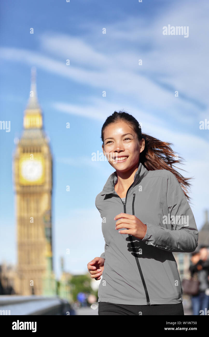 Healthy city lifestyle fitness runner woman. Cute Asian girl in grey ...