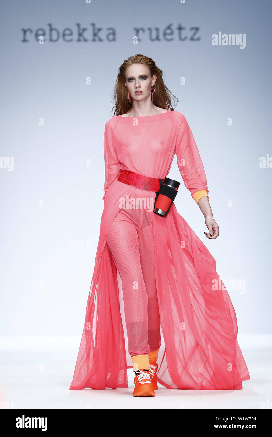 Berlin, Germany. 3rd July, 2019. A model presents a creation of Rebekka ...