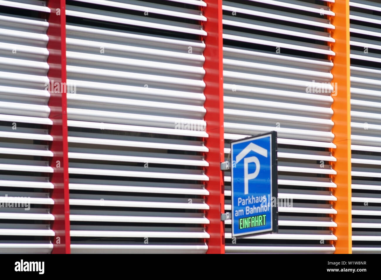 The architectural detail of the modern facade of a parking garage with ...