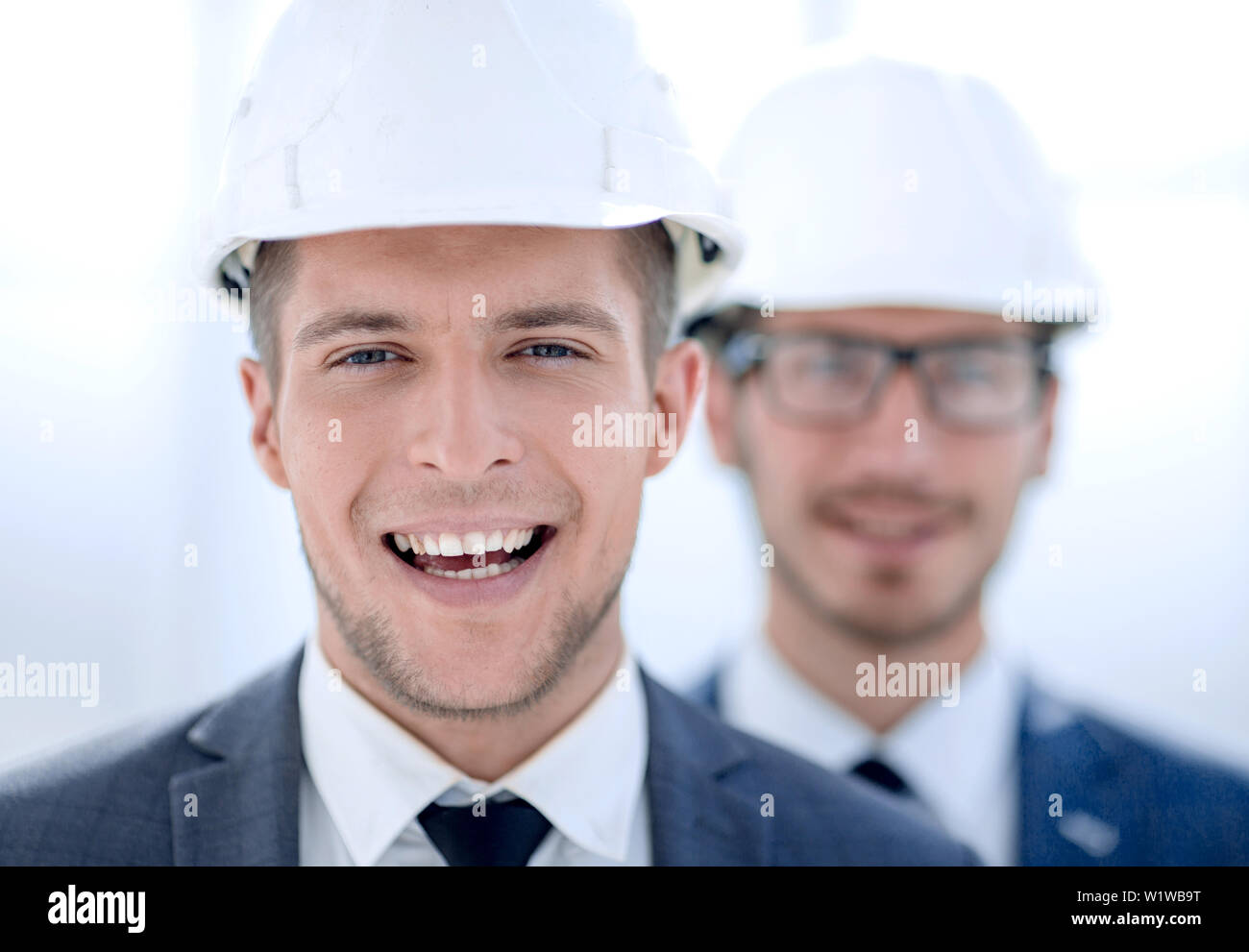businessmen in hard hats close-up Stock Photo - Alamy