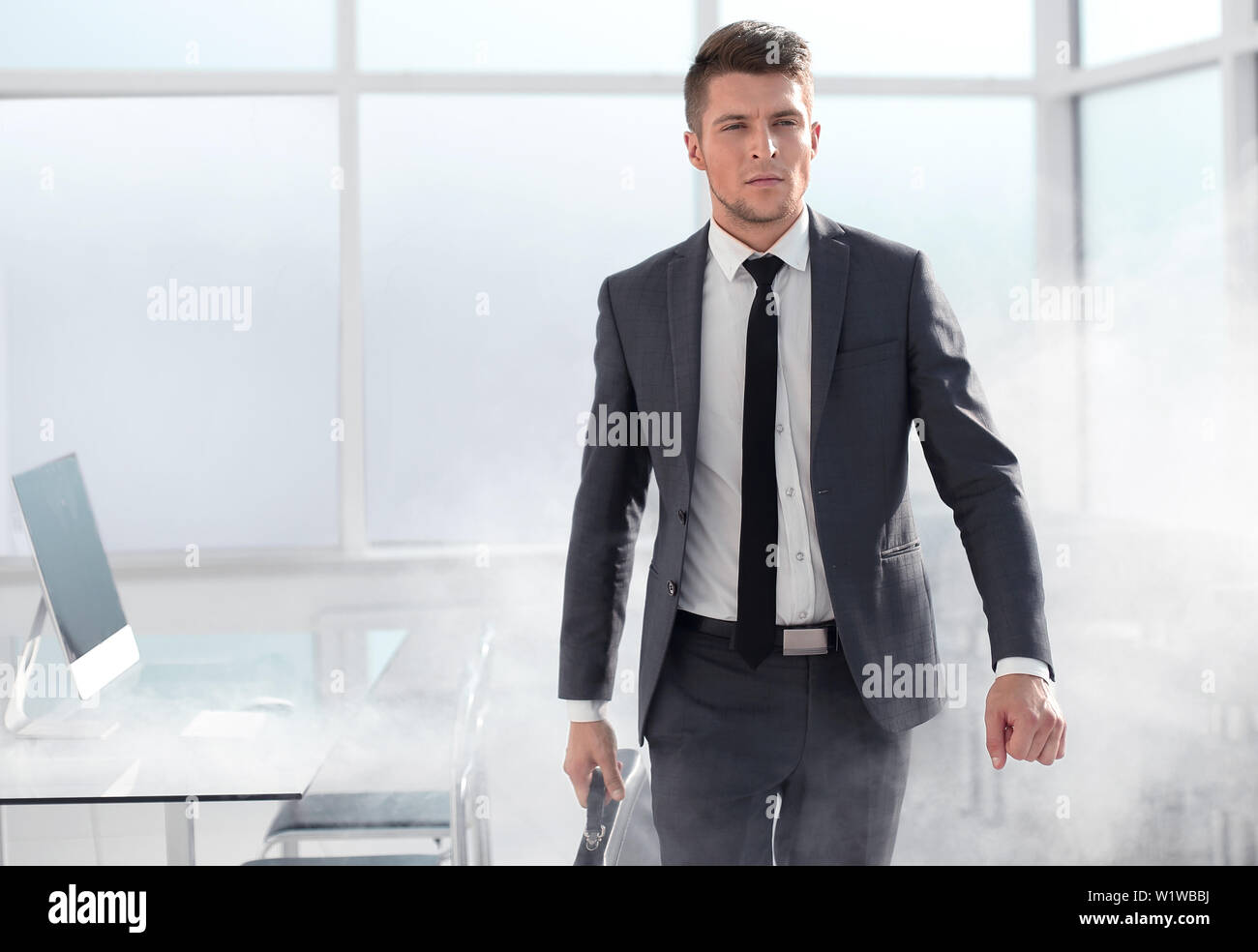 one man comes out of a smoky office Stock Photo - Alamy