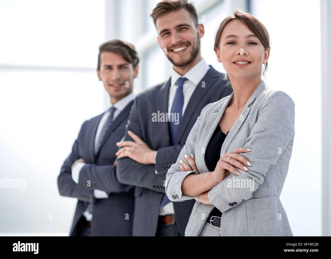company employees standing together Stock Photo - Alamy
