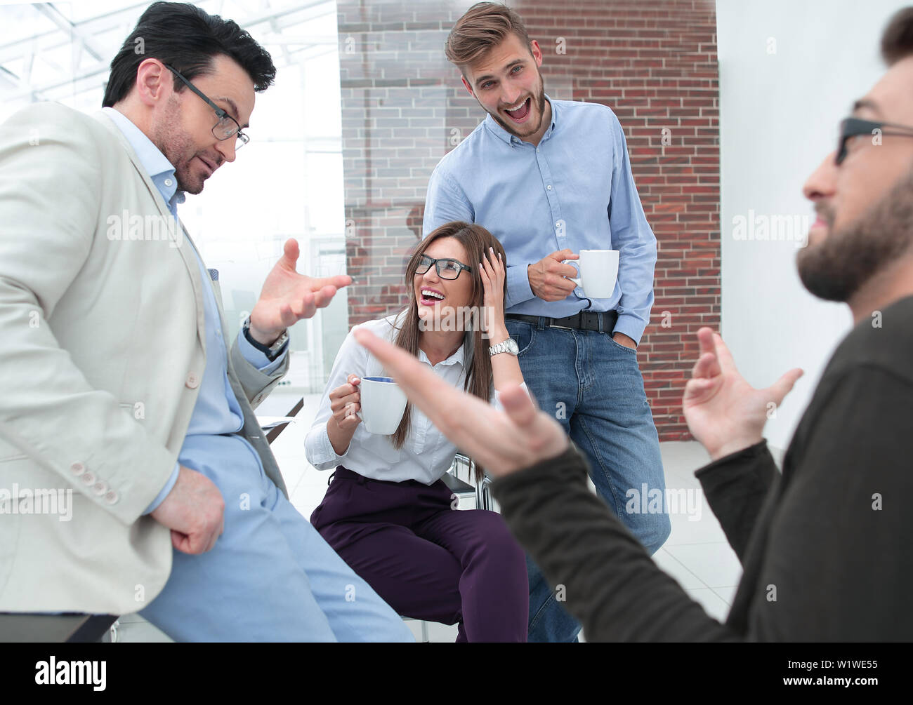 fun business team talking during a coffee break in the office Stock ...