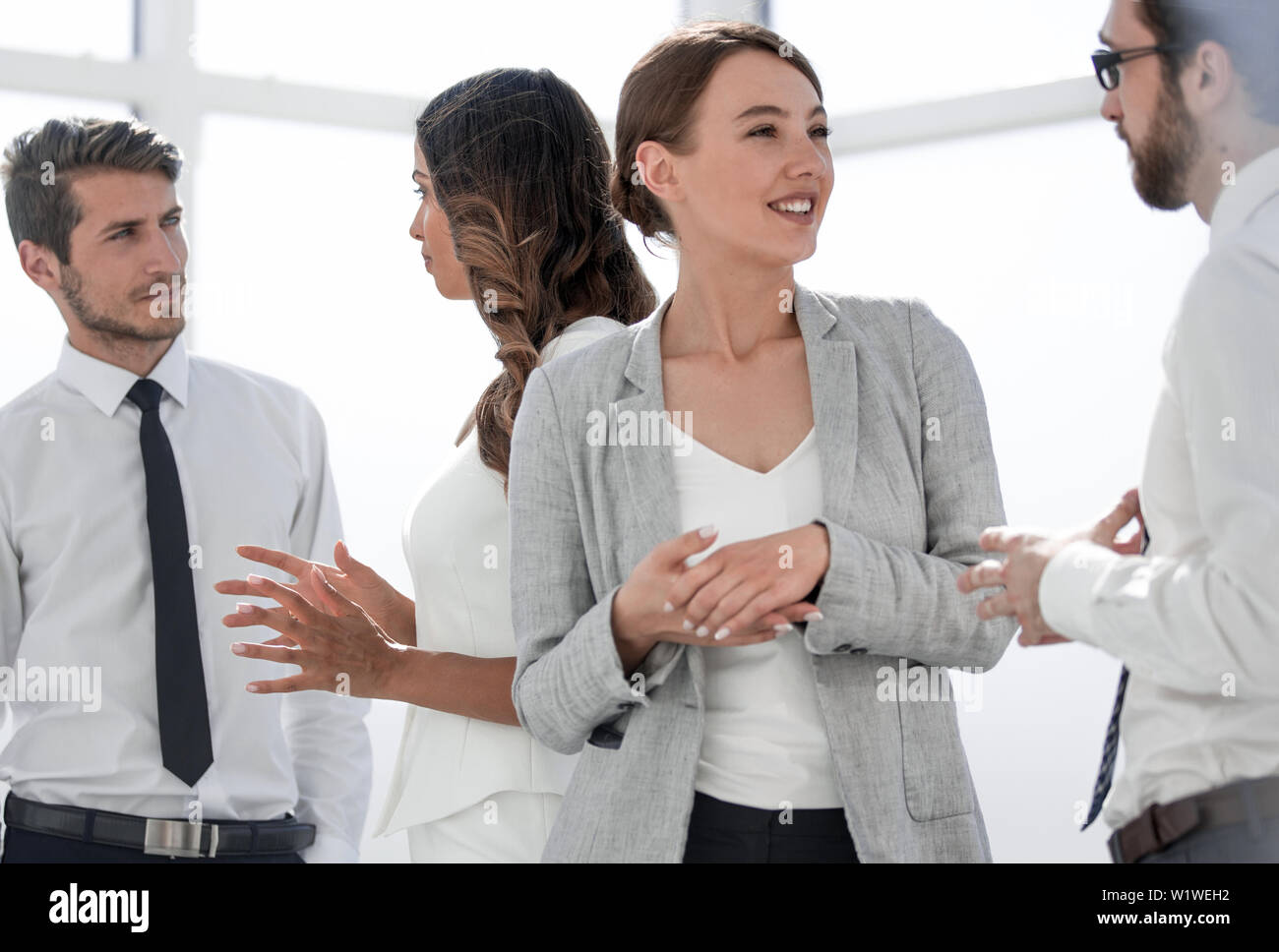 young employees talk in the office Stock Photo - Alamy