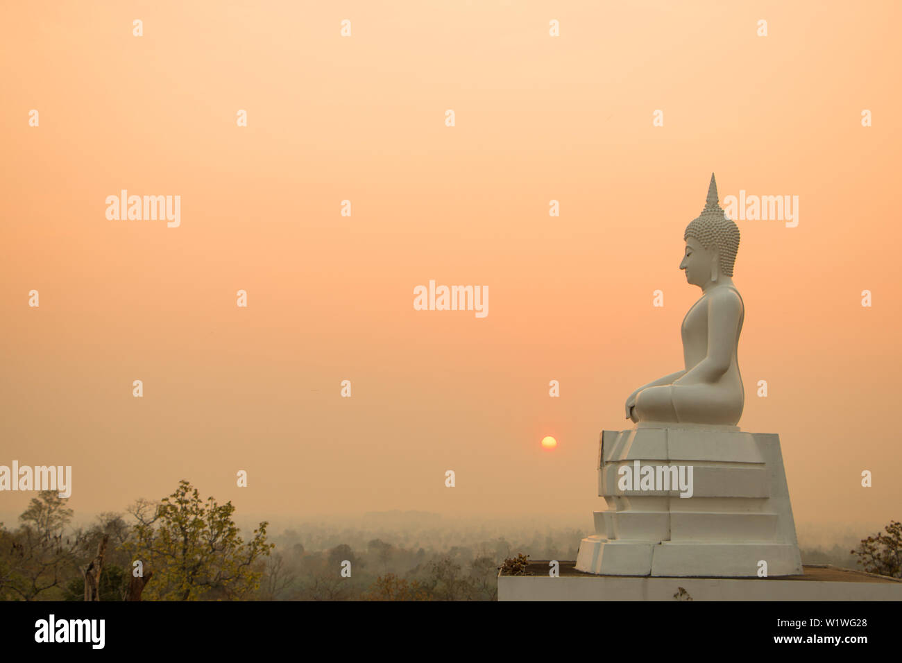 Buddha statue with sunset or sunrise background Stock Photo - Alamy