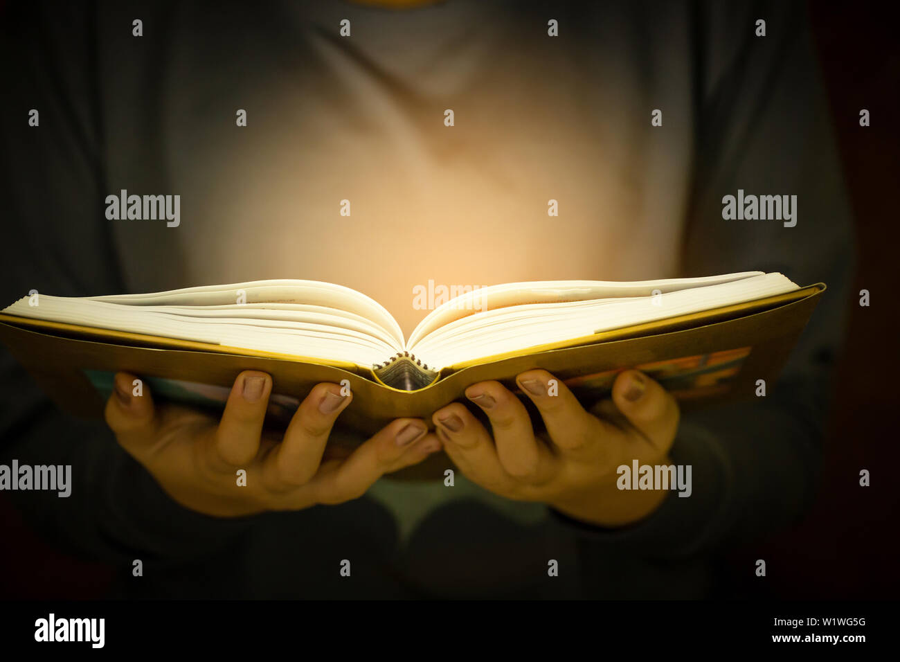 Closeup hand open book for reading concept Stock Photo - Alamy