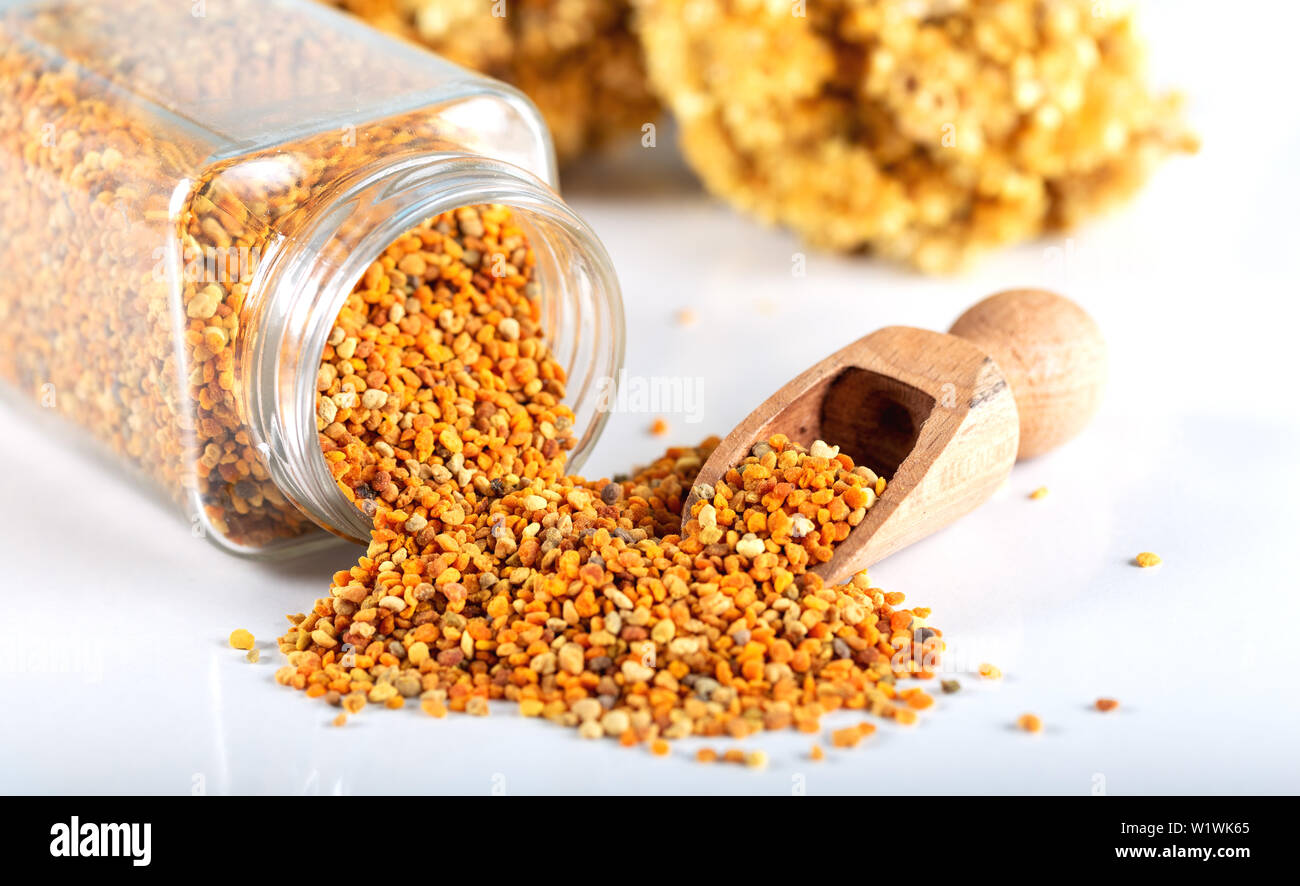 Bee pollen grains on a white background Stock Photo - Alamy