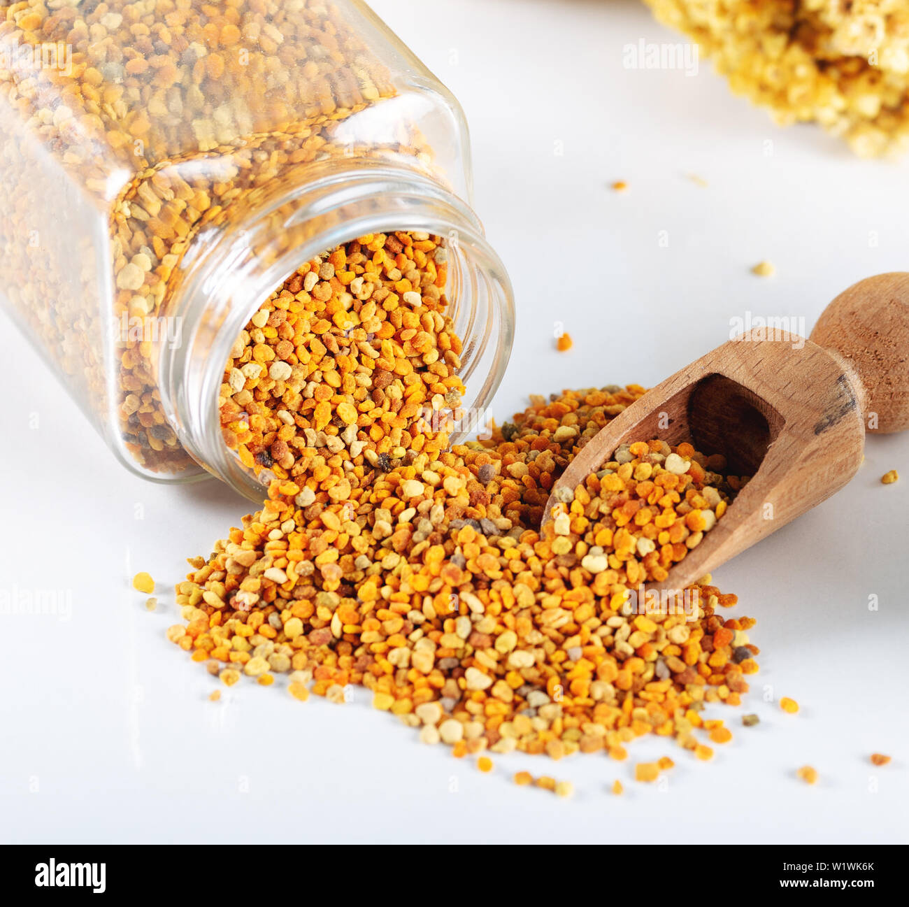 Bee pollen grains on a white background Stock Photo - Alamy