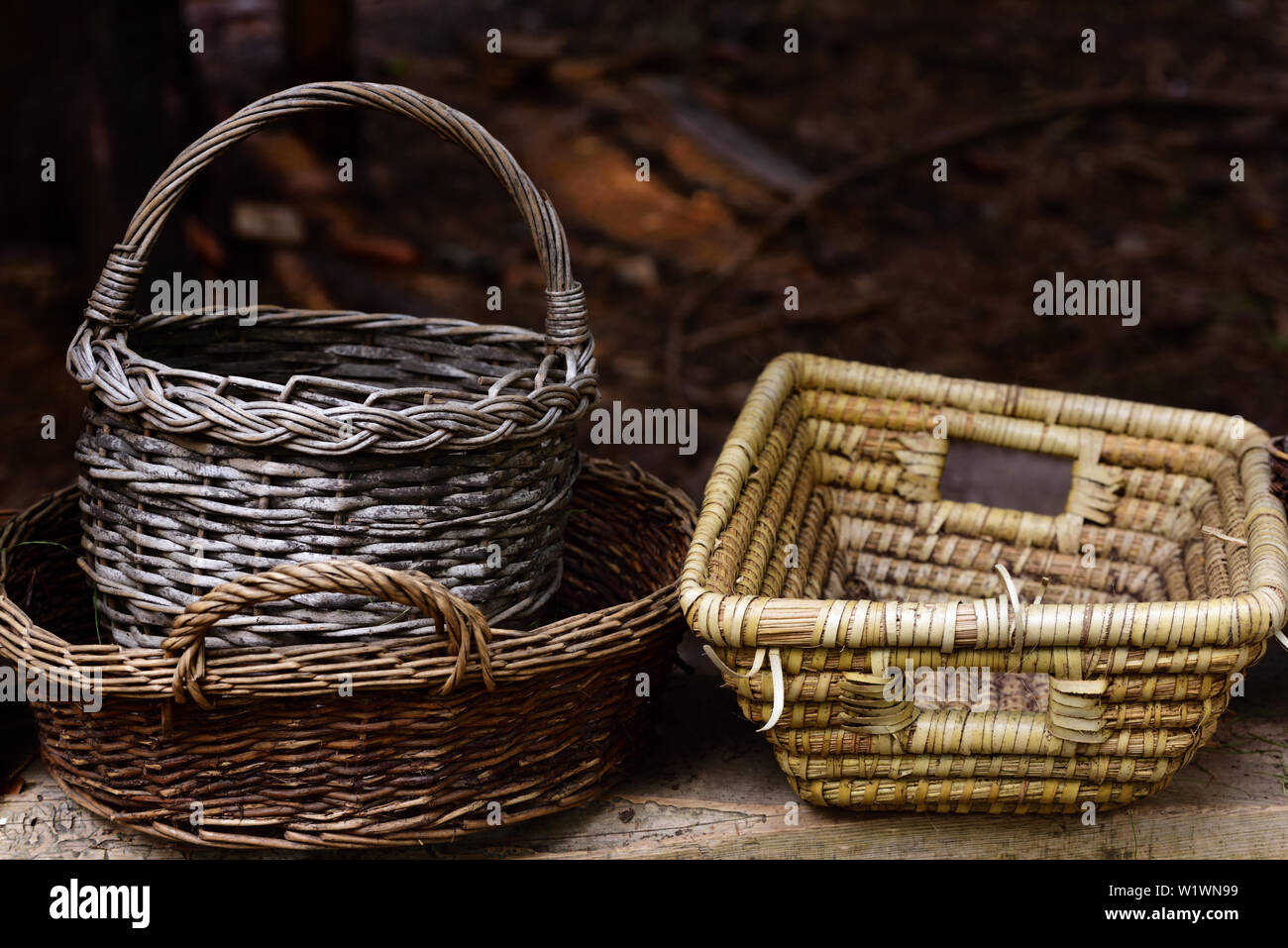 Old empty wicker baskets are standing outdoors Stock Photo - Alamy