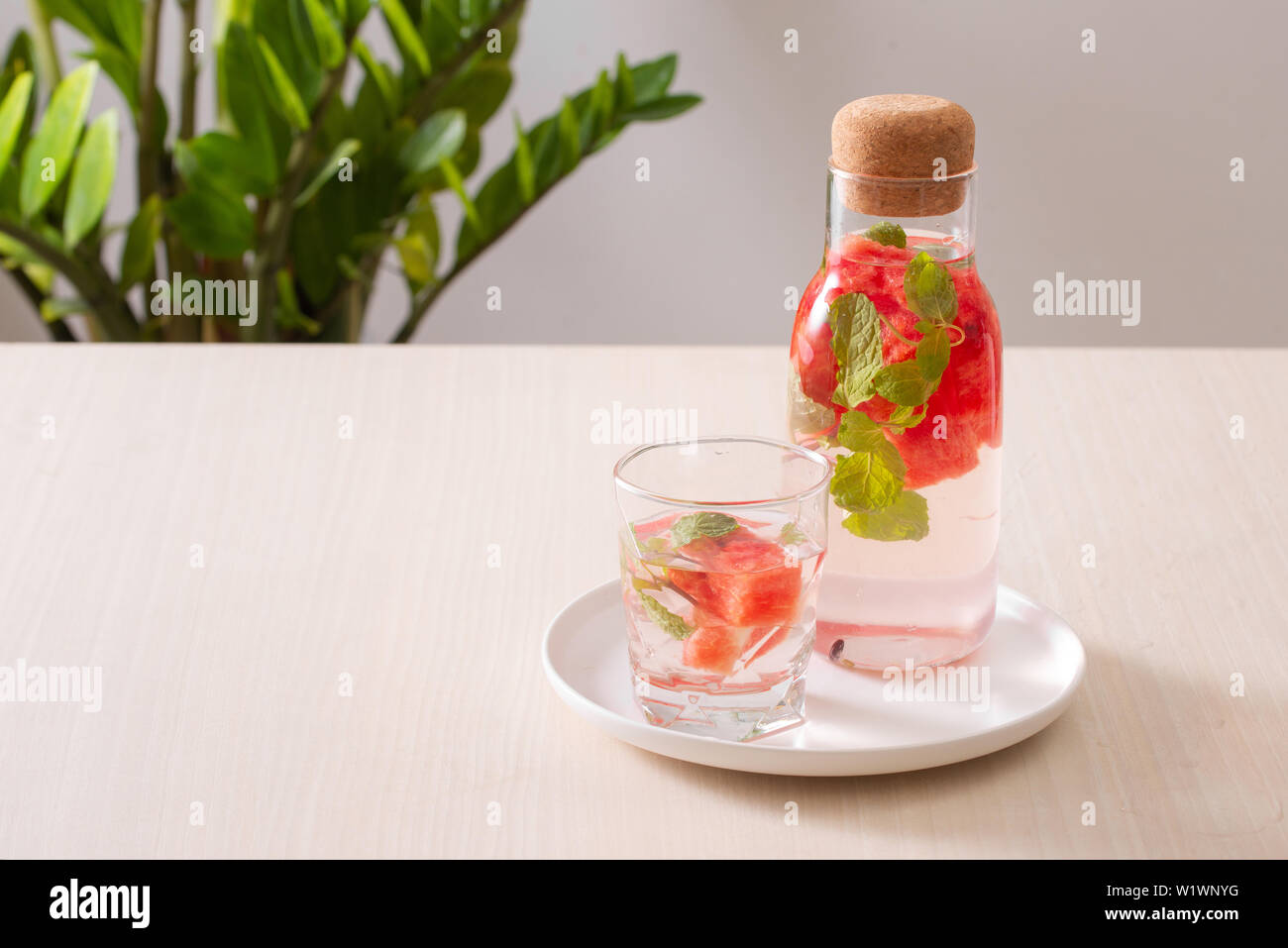 Watermelon infused water on white background Stock Photo - Alamy