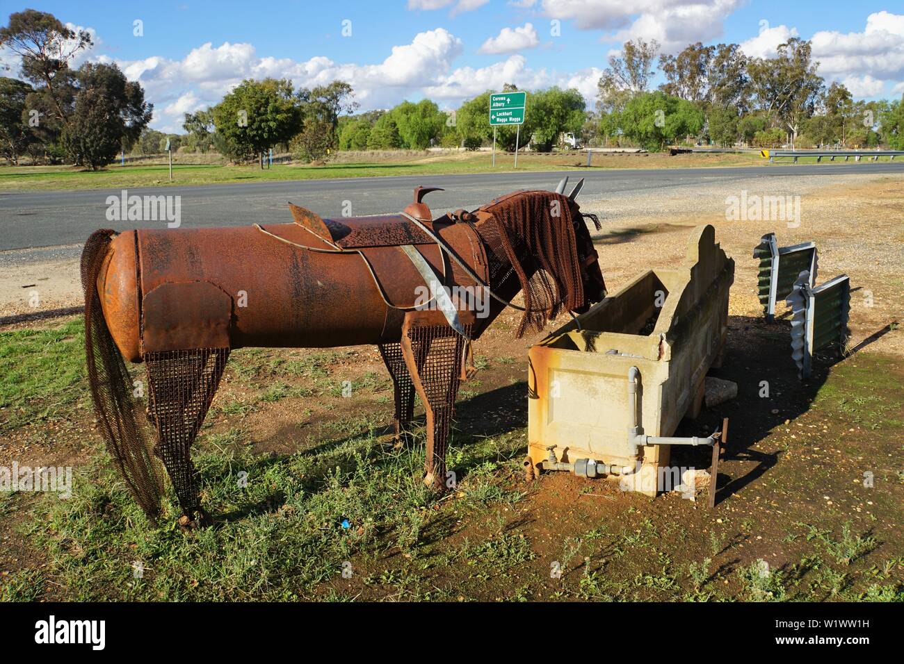 Vintage Bills Horse Trough with a Scrap Metal Horse pretending to drink ...
