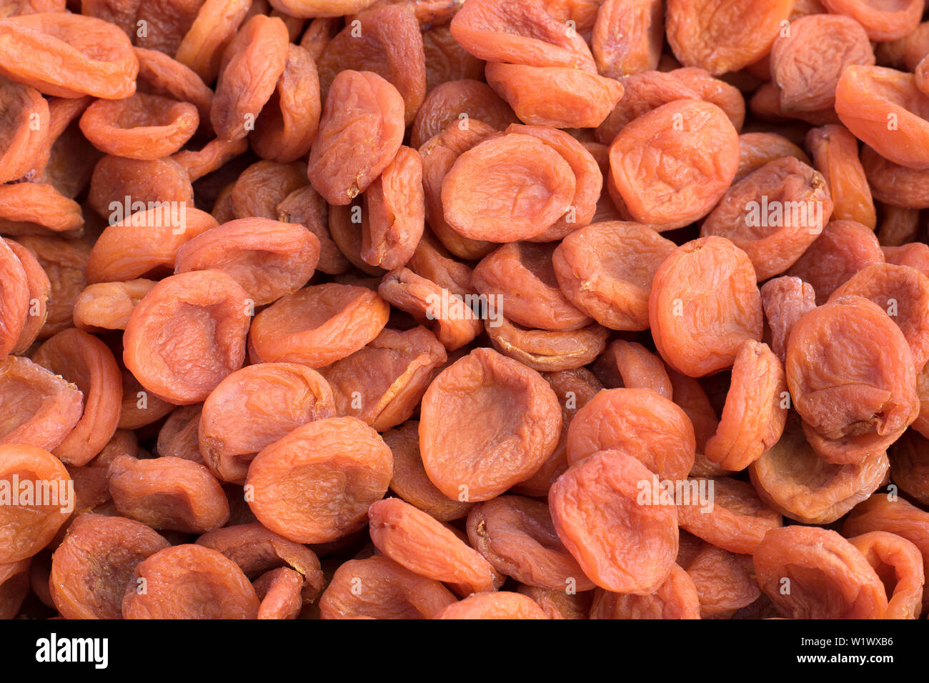 Dried fruits-dried apricots and prunes of bright saturated colors are ...