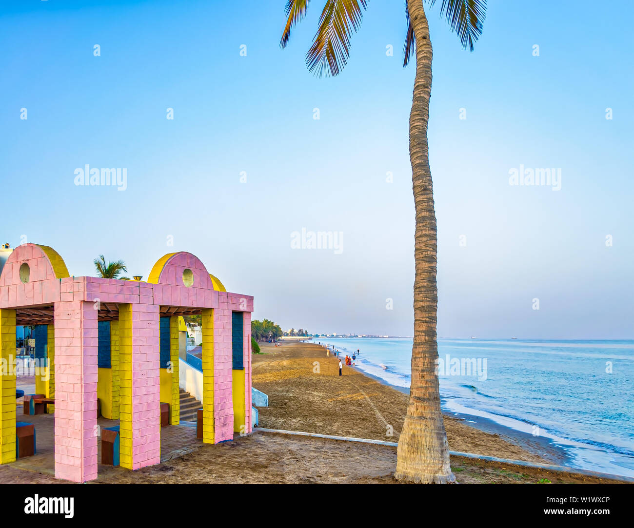 Pink & Yellow Shelter and a Coconut Tree on the Beach. From Muscat ...