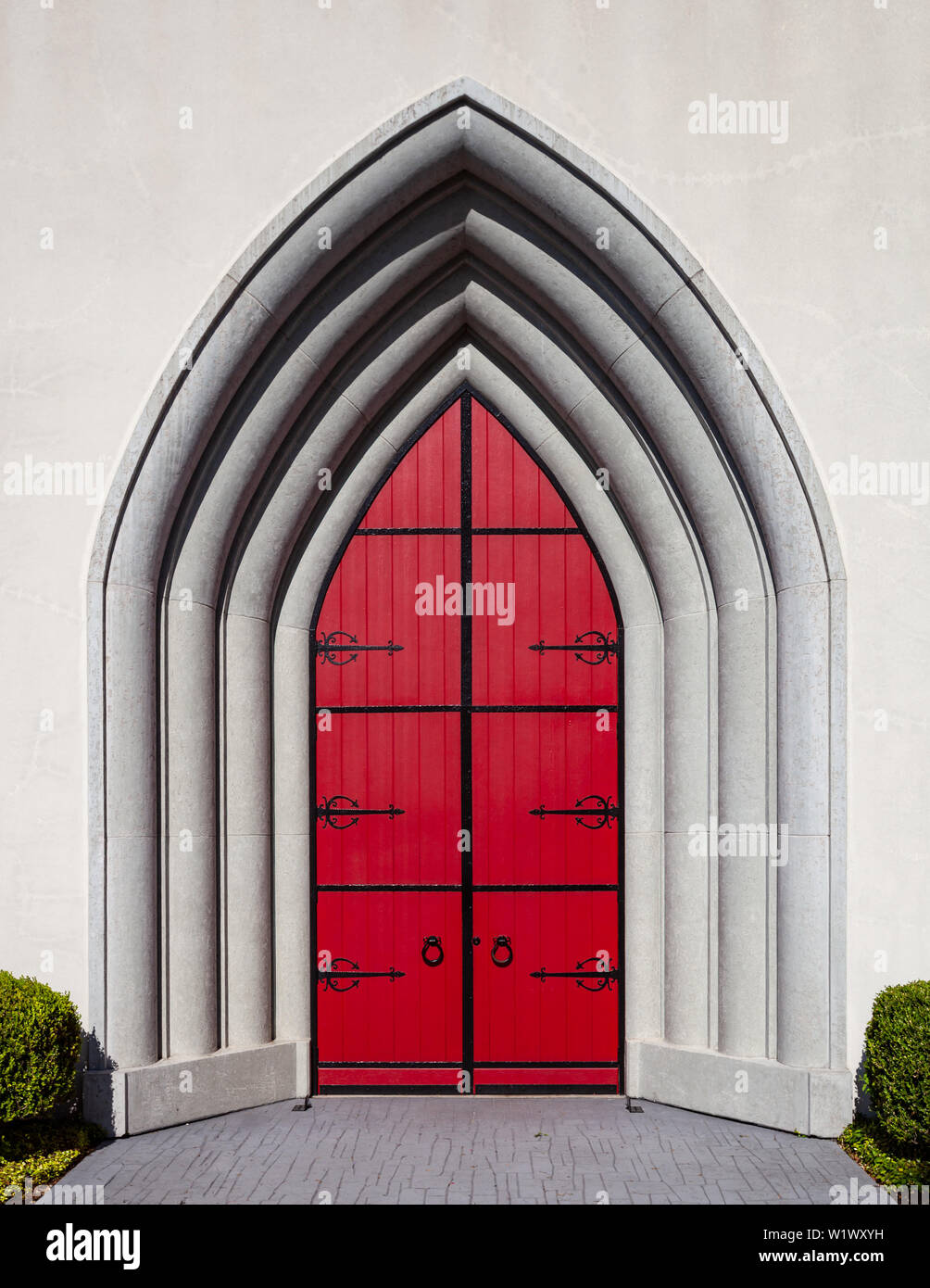 Gothic style door, painted bright red, front view Stock Photo - Alamy
