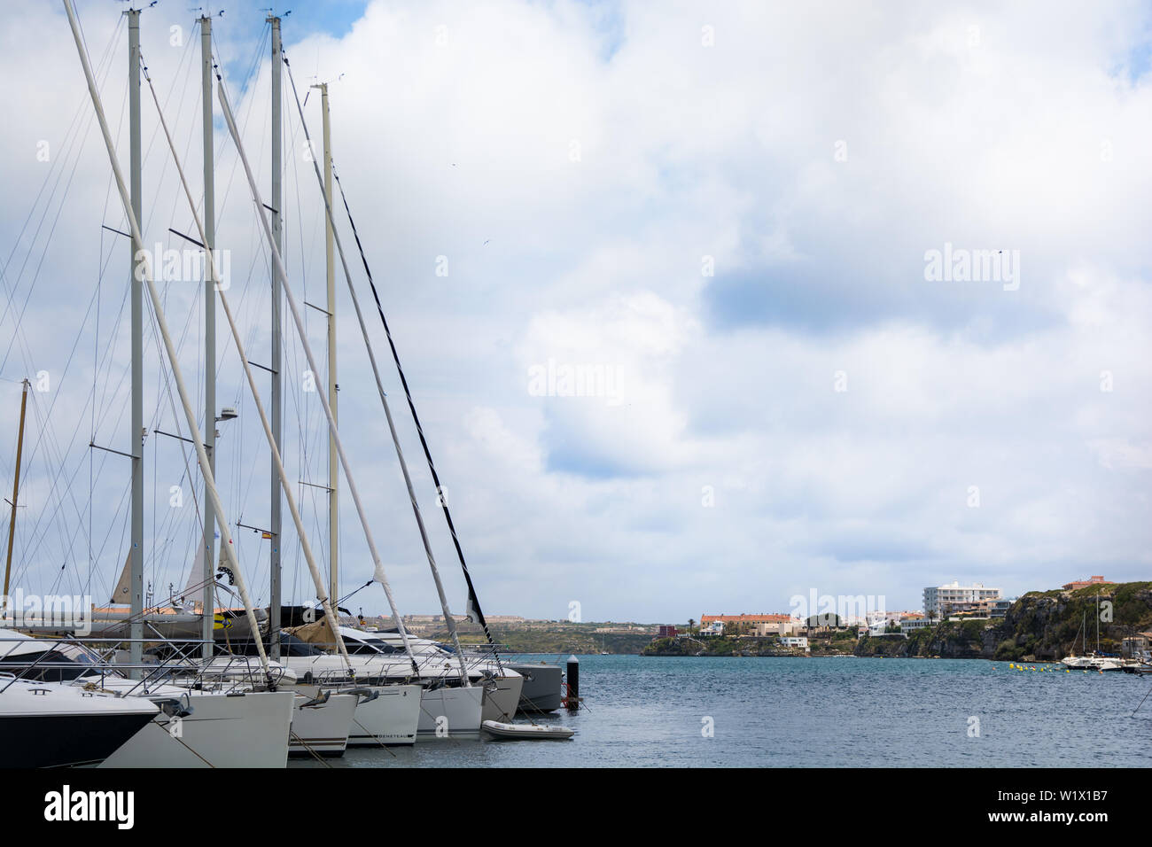 Sailing yachts lined up in Mahon marina, Menorca Stock Photo - Alamy