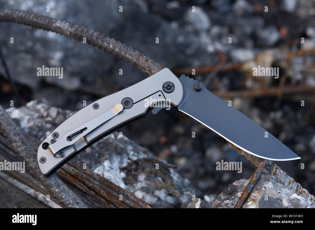 Folding knife. Curved knife. Aluminum handle knife Stock Photo - Alamy