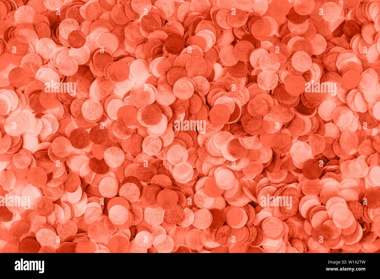 Bright coral confetti isolated on white background Stock Photo - Alamy
